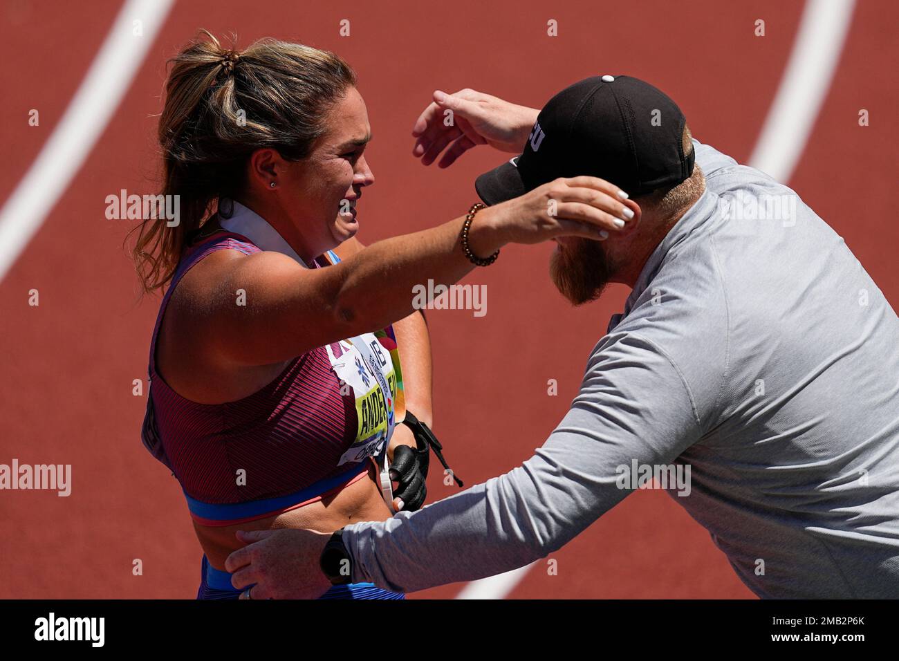 Gold medalist Brooke Andersen, of the United States, gets a hug after ...