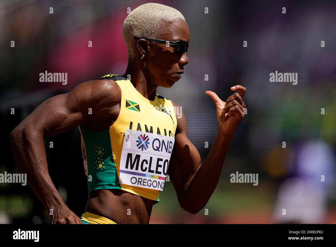 Candice Mcleod, of Jamaica, competes a heat in the women's 400-meter ...