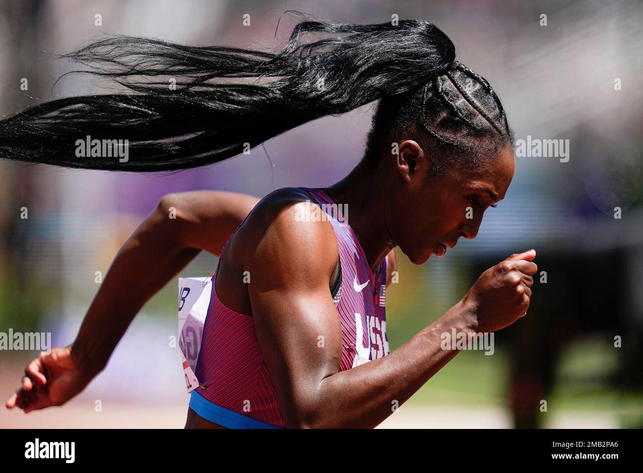 Talitha Diggs, of the United States, competes in a heat in the women's ...