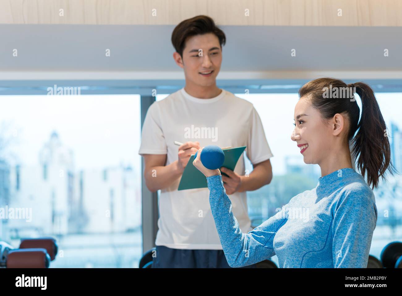 A young woman in private teaching under the guidance of fitness Stock ...