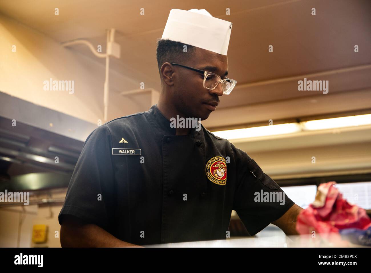 U.S. Marine Corps Lance Cpl. Rashaud Walker, a food service specialist ...