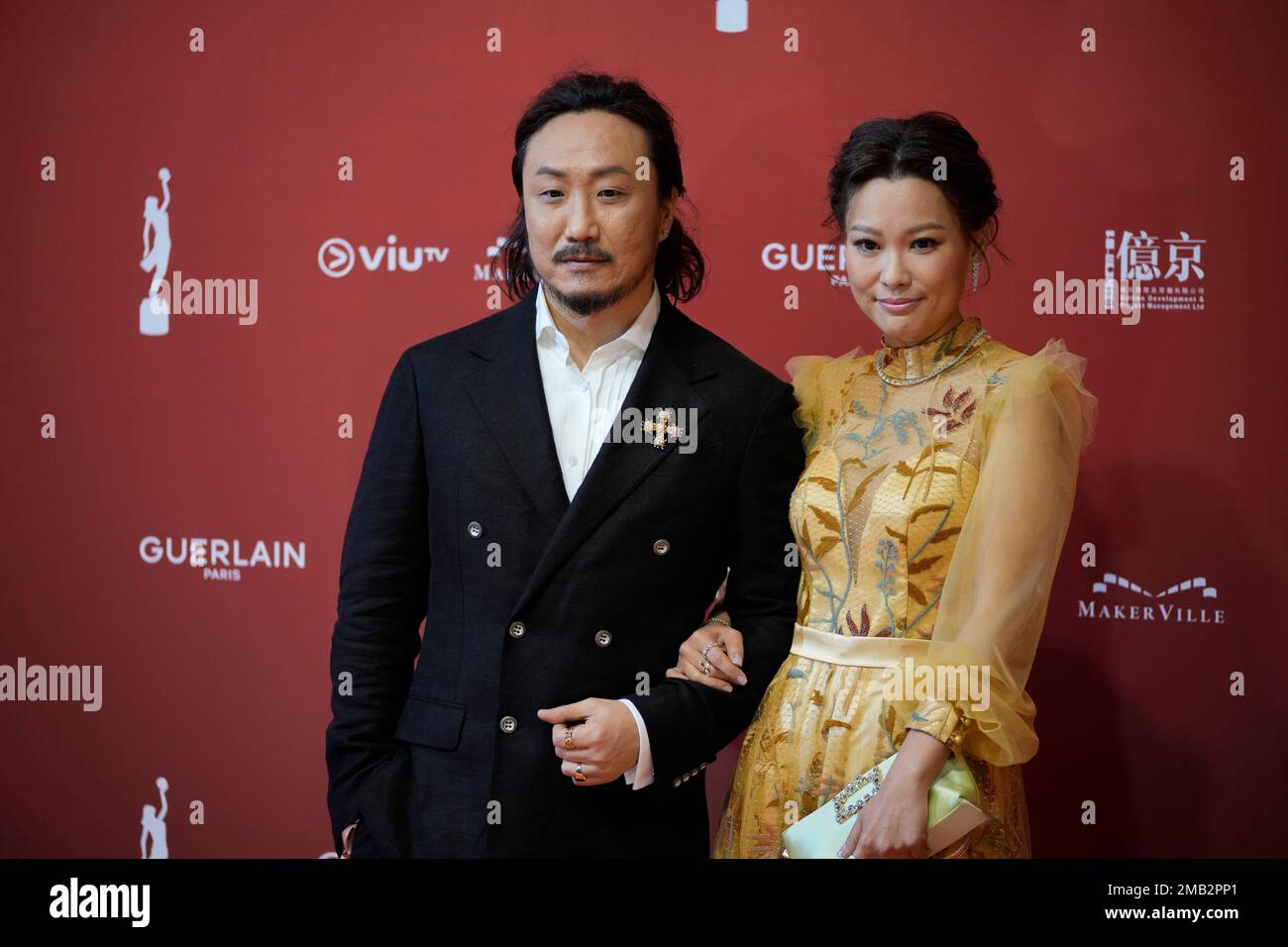 Hong Kong actor Ronald Cheng, left, poses with his wife on red carpet ...