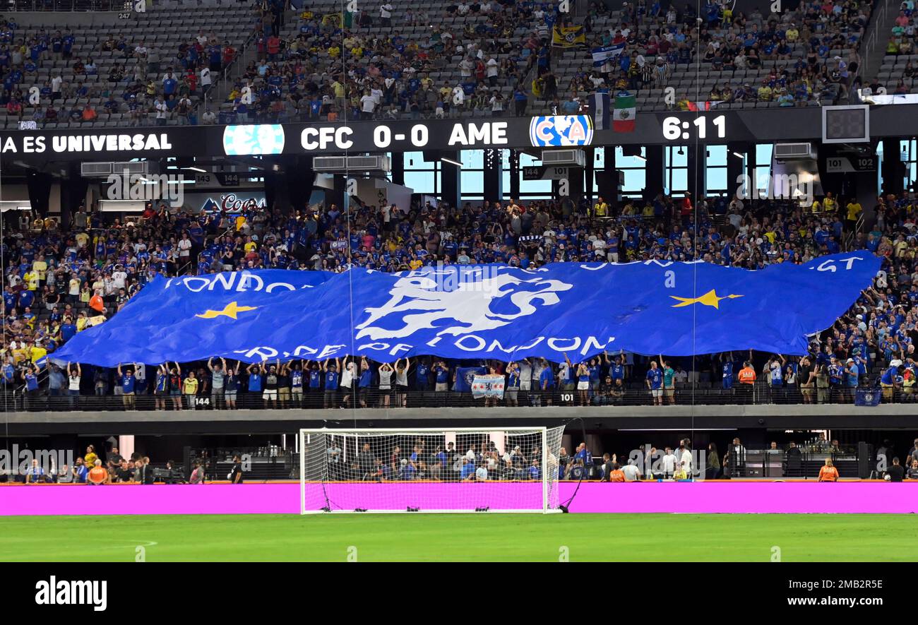 Chelsea fans raise a banner before a soccer match between Chelsea and ...