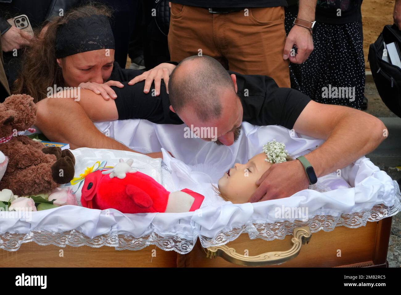 Artem Dmitriev gives the last salute to his daughter Liza, 4-year-old girl killed by Russian ...
