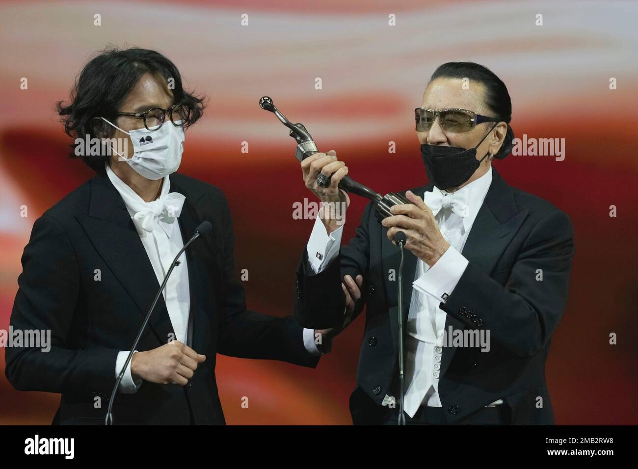 Hong Kong actor Patrick Tse, right, speaks after winning the Best Actor ...