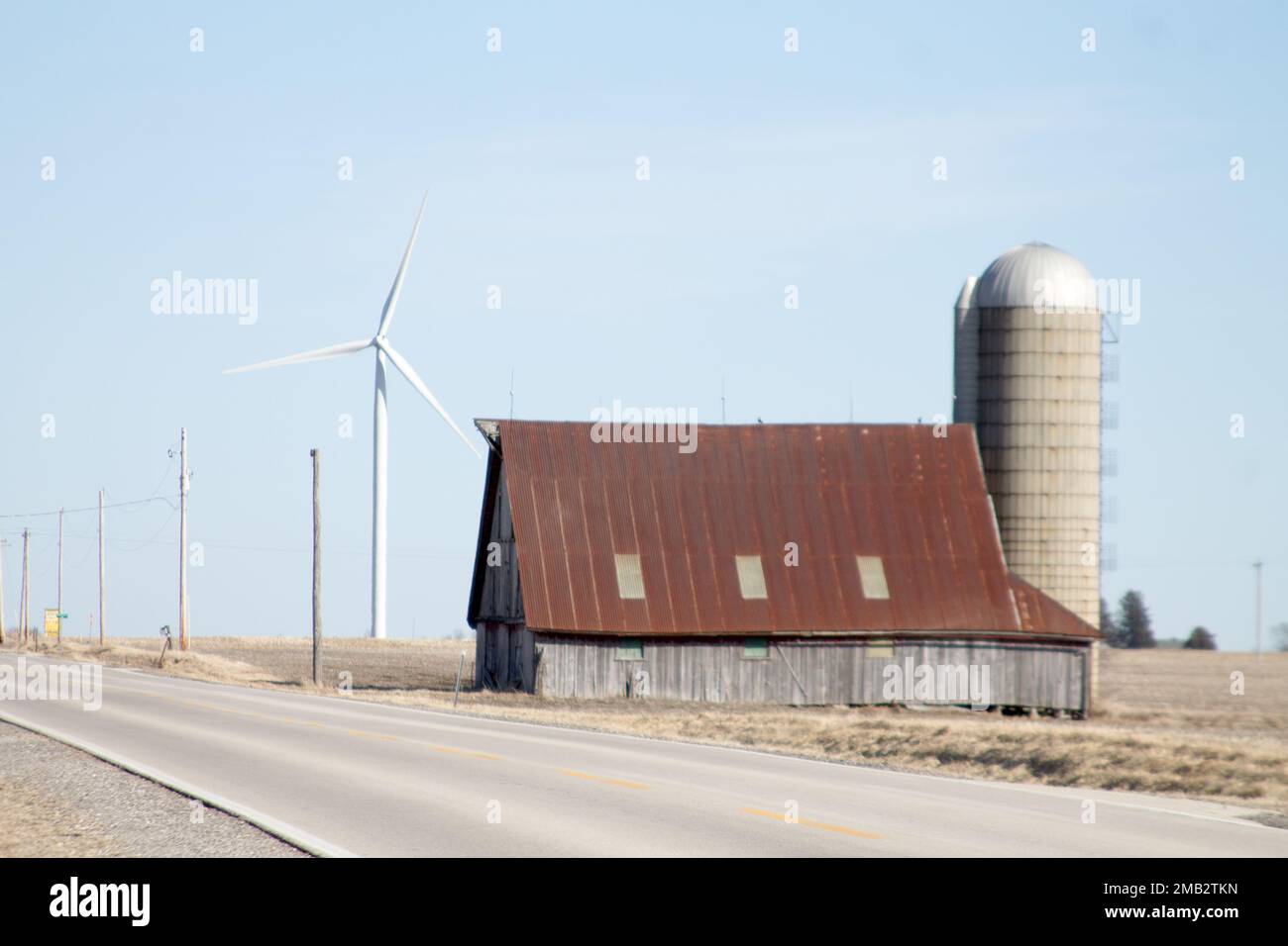 A Silos tower surrounded by windmills Stock Photo - Alamy