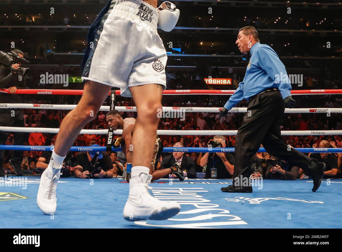 Javier Fortuna knees on the canvas after being knocked down by Ryan ...