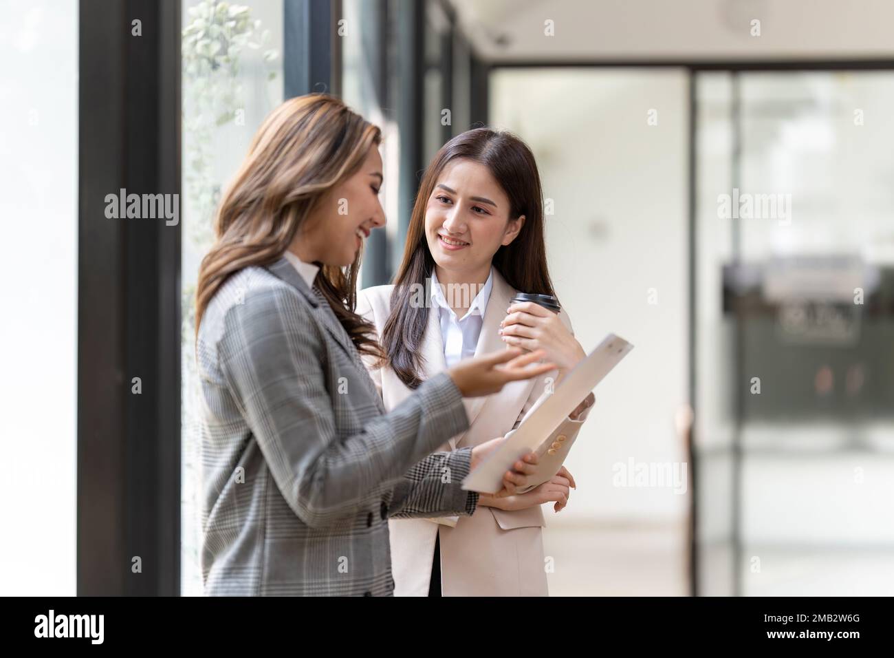 Smart business people working together with paperwork while talking in ...
