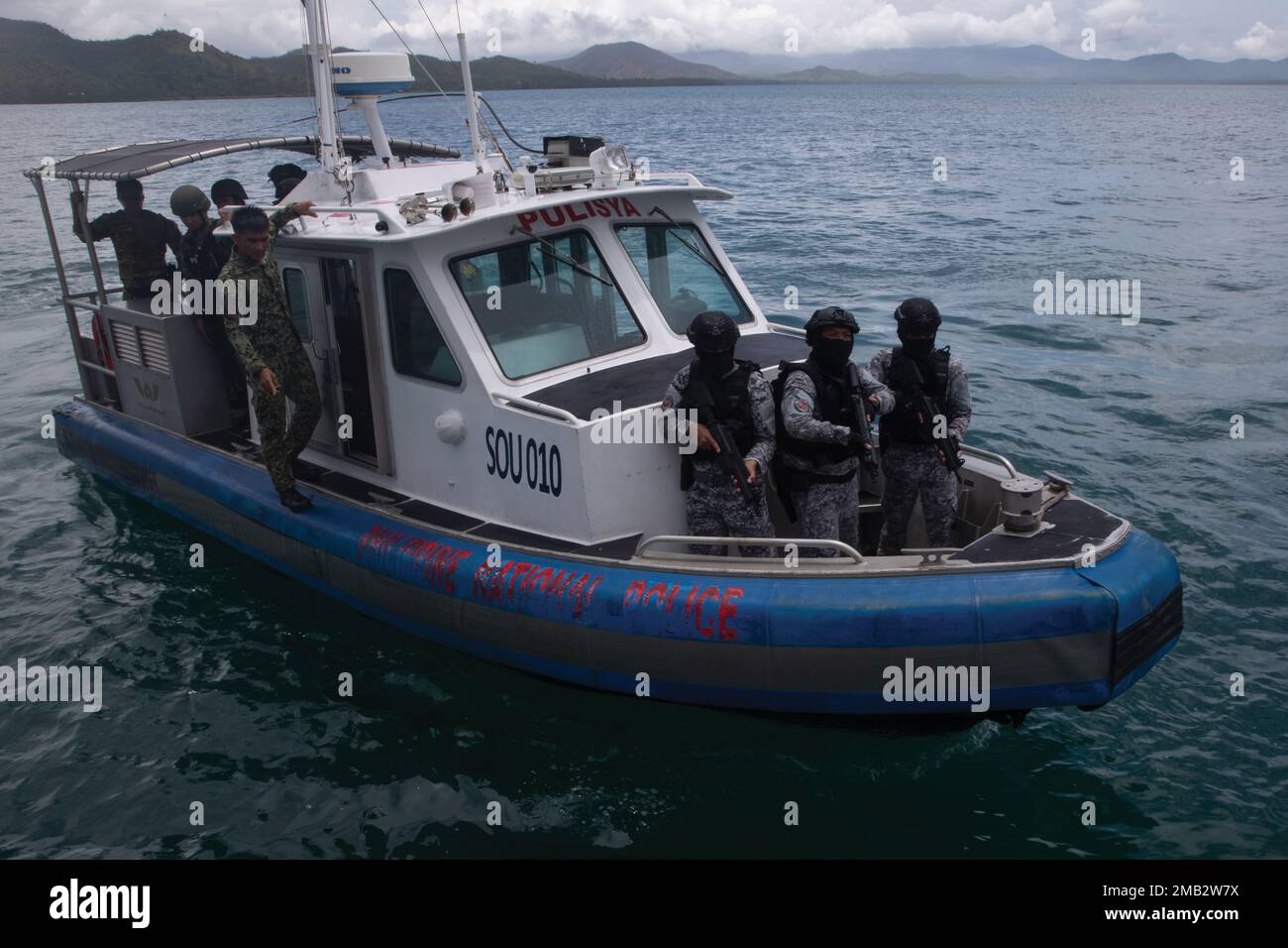A rigid-hull inflatable boat filled with members of the Philippine ...