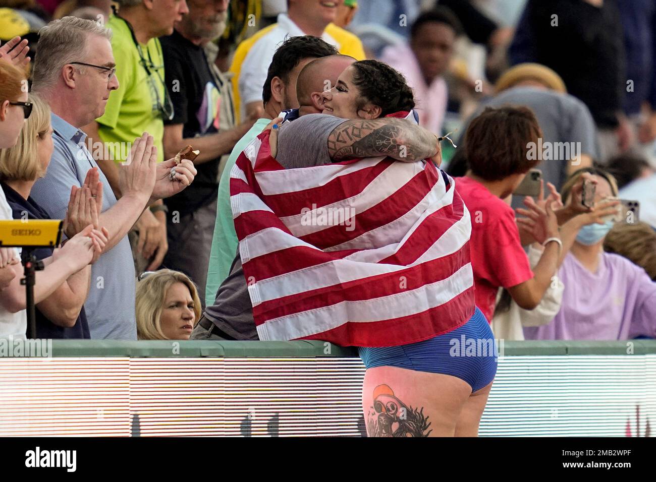 Chase Ealey, of the United States, gets a hug after wining the gold ...