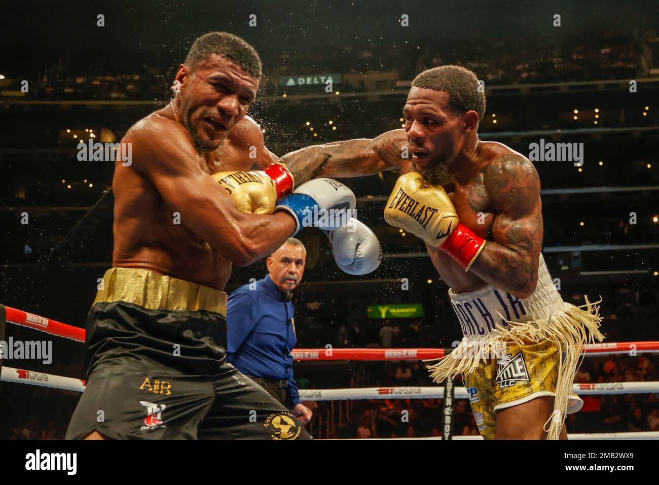 Lamont Roach Jr. , right, and Angel Rodriguez fight during a 12 Rounds ...