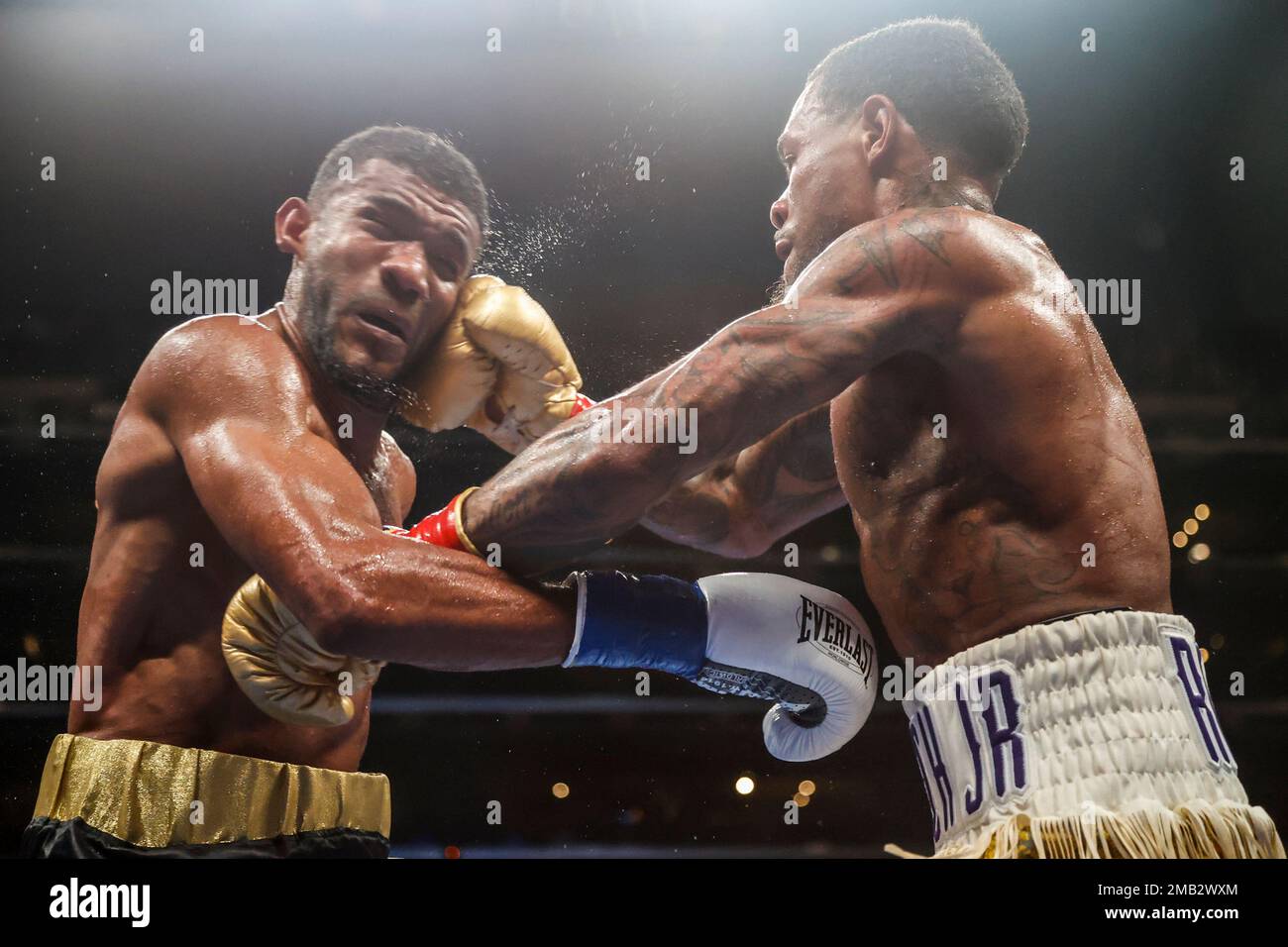 Lamont Roach Jr. , right, and Angel Rodriguez fight during a 12 Rounds ...