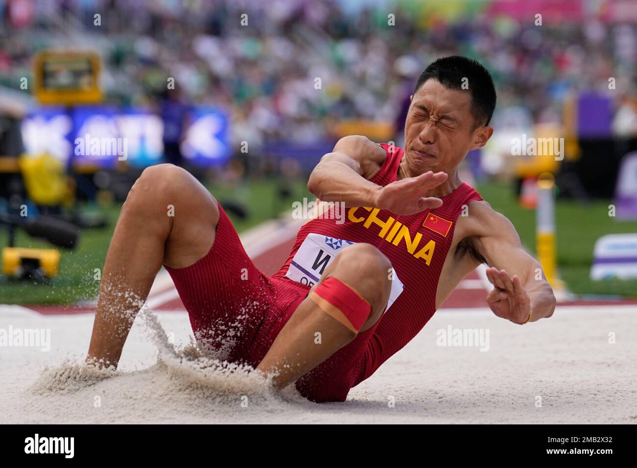 Wang Jianan, of China, competes during the men's long jump final at the ...