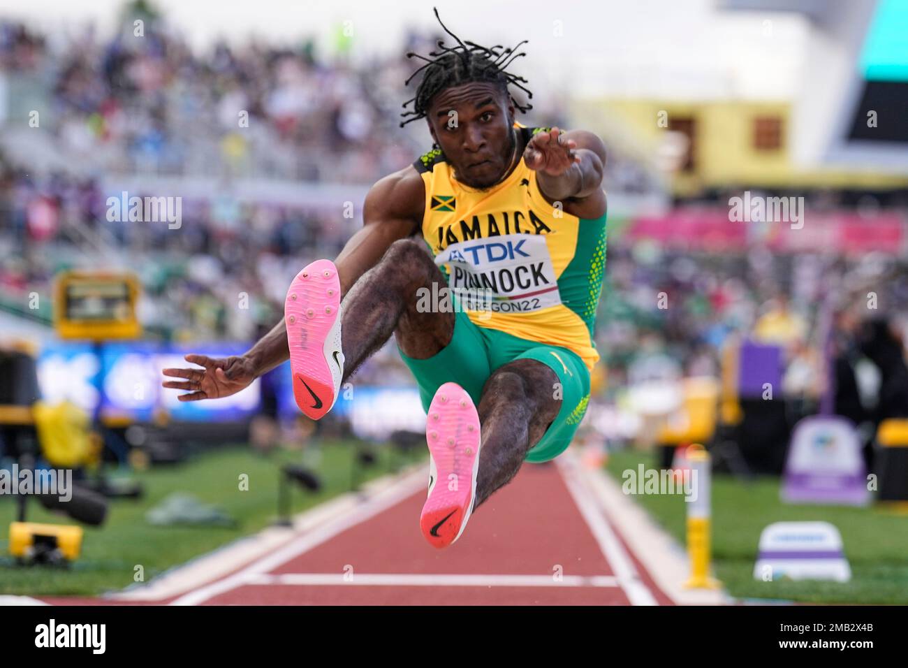 Wayne Pinnock, of Jamaica, competes during the men's long jump final at ...