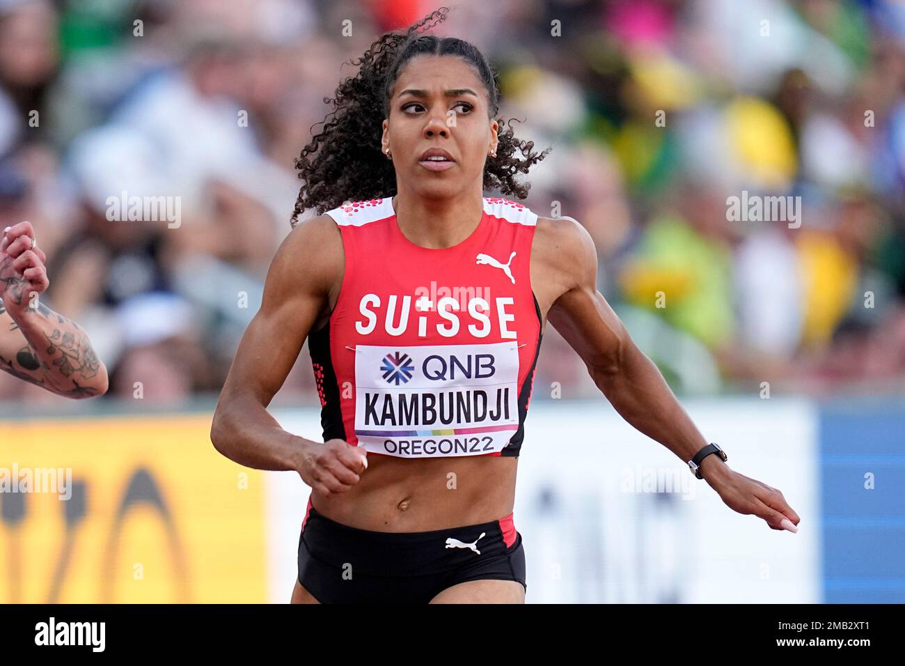 Mujinga Kambundji, of Switzerland, wins a heat in the women's 100-meter ...