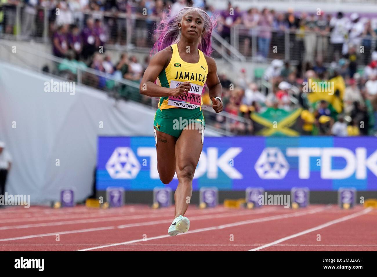 Shelly-Ann Fraser-Pryce, of Jamaica, wins a heat in the women's 100-meter run at the World ...