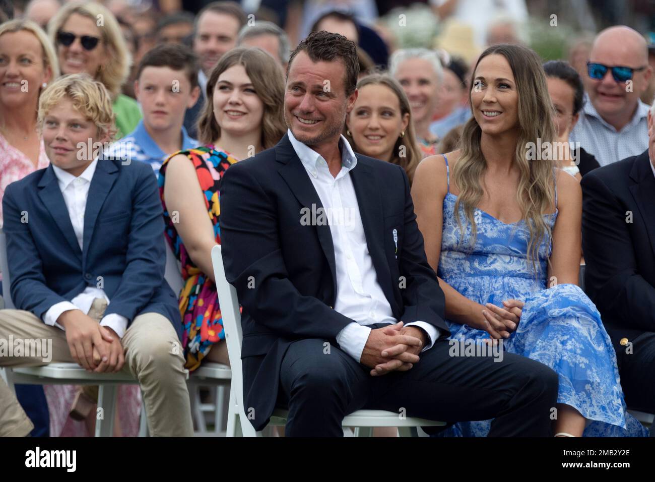 Lleyton Hewitt, center, of Australia, smiles as he watches a tribute ...