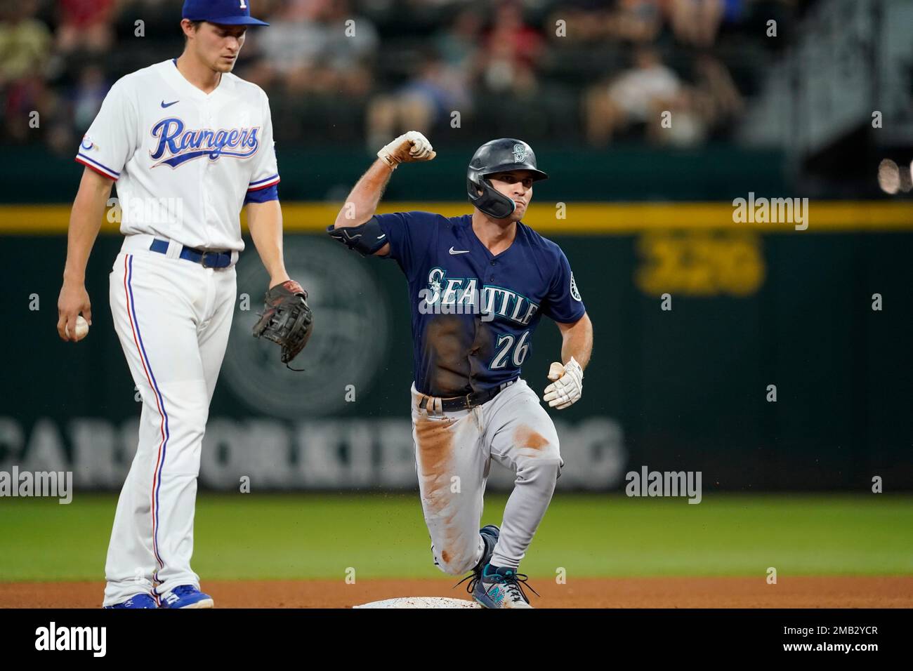 Seattle Mariners' Adam Frazier (26) celebrates his double as Texas ...