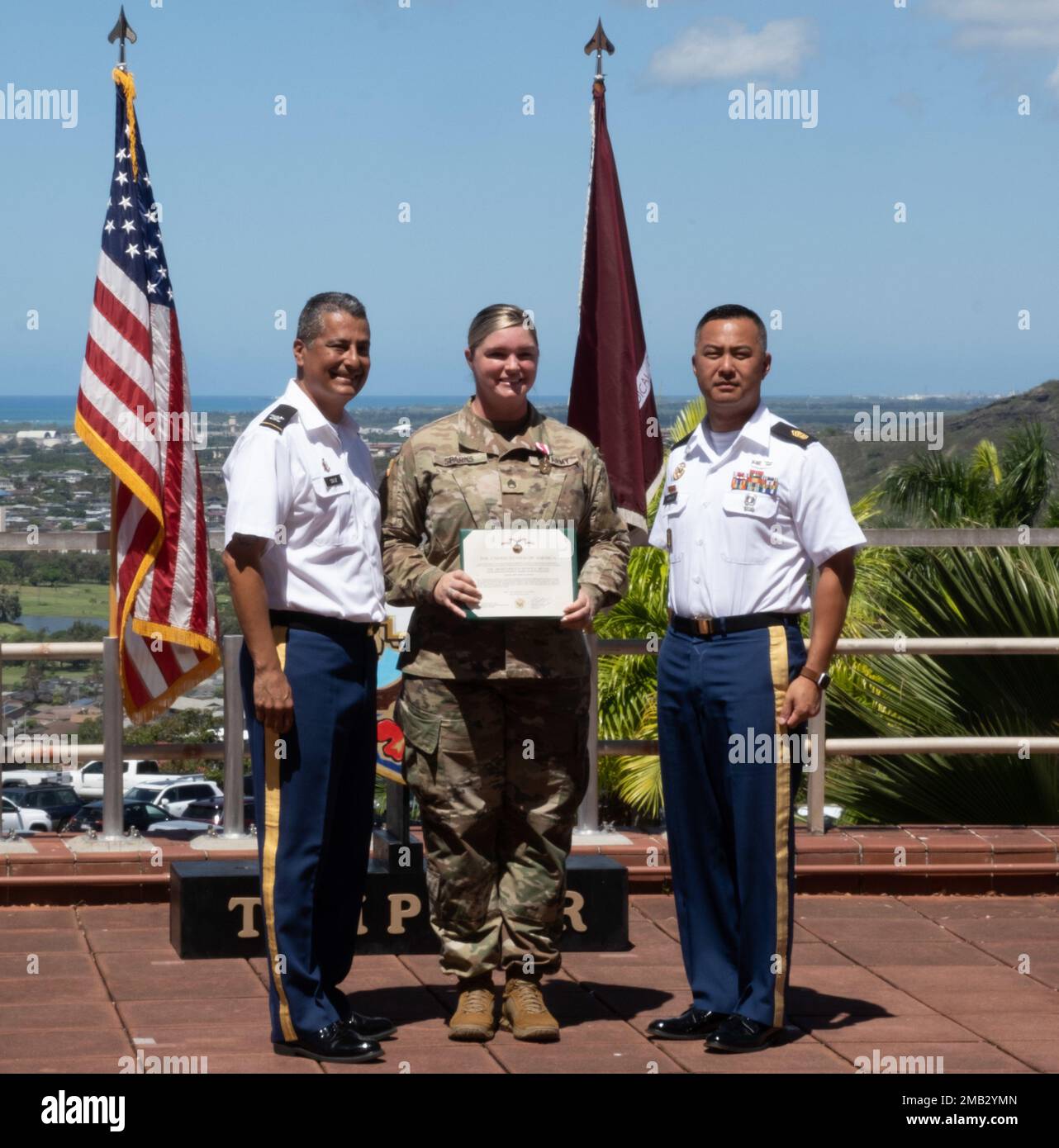 Col. Bill Soliz, commander, Tripler Army Medical Center, awards the ...
