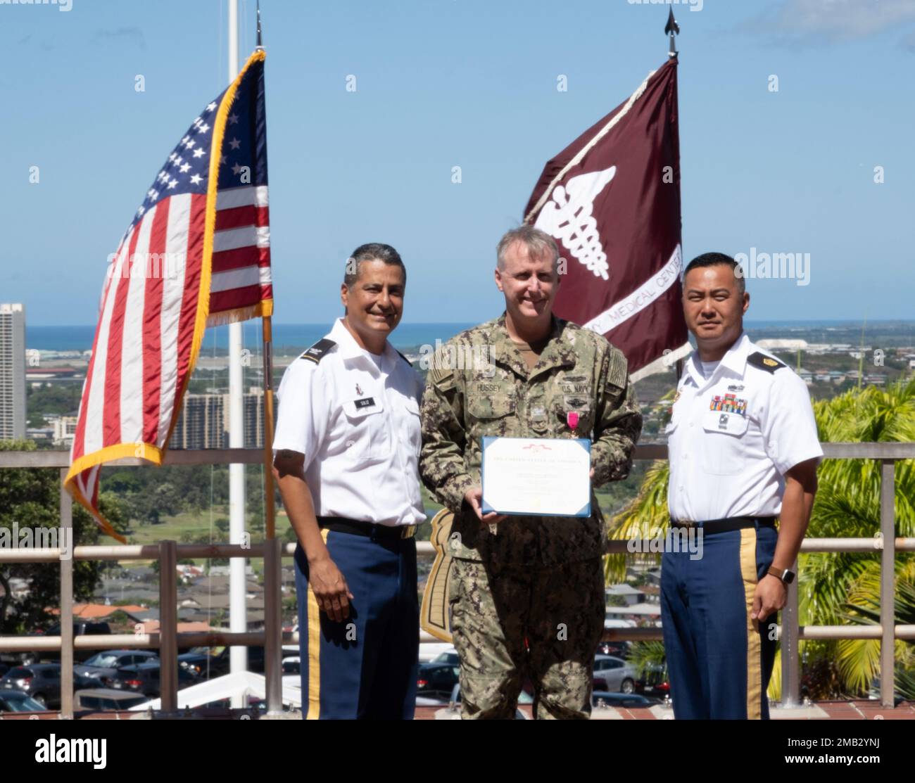 Col. Bill Soliz, commander, Tripler Army Medical Center, awards the ...
