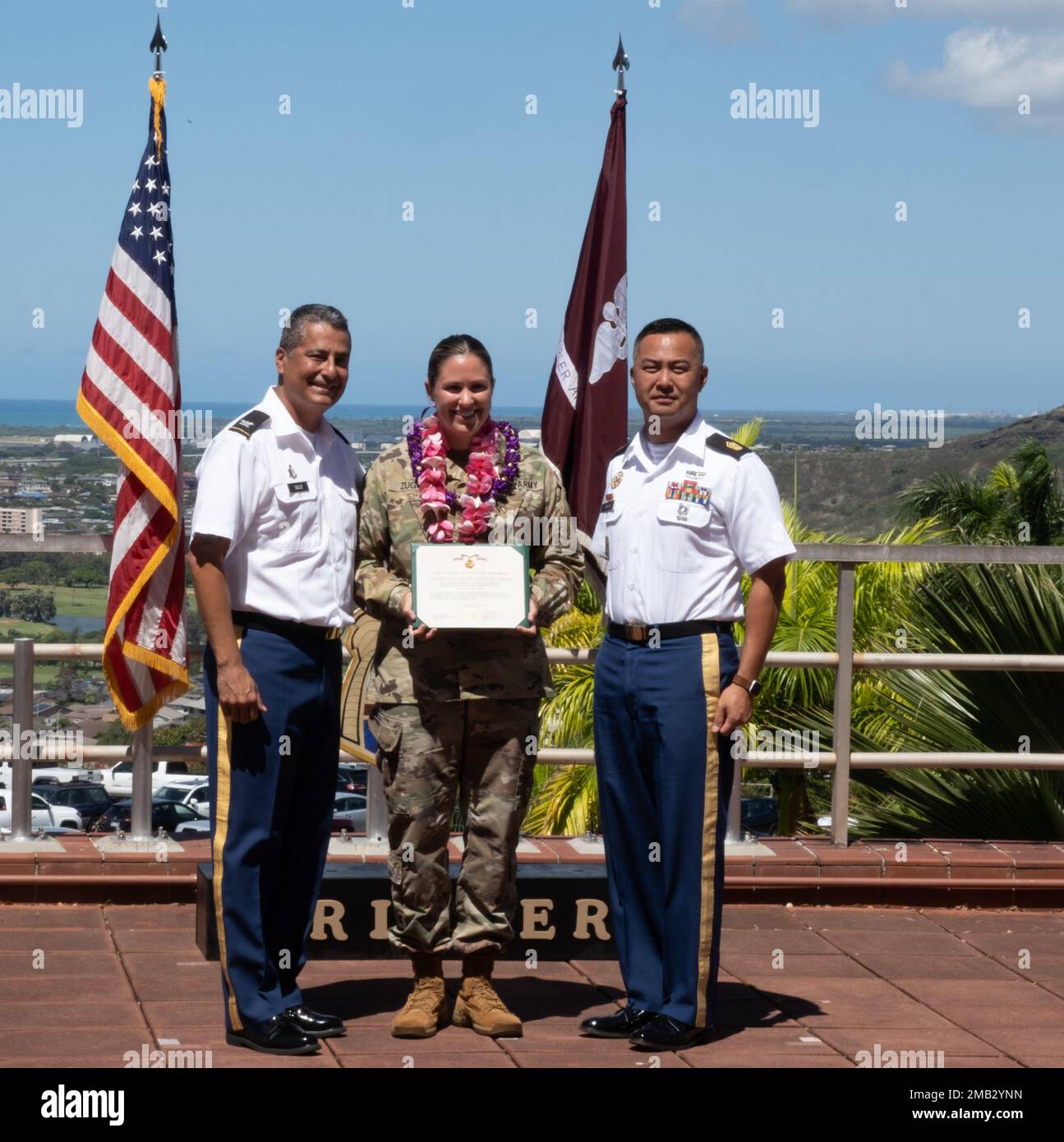 Col. Bill Soliz, commander, Tripler Army Medical Center, awards the ...
