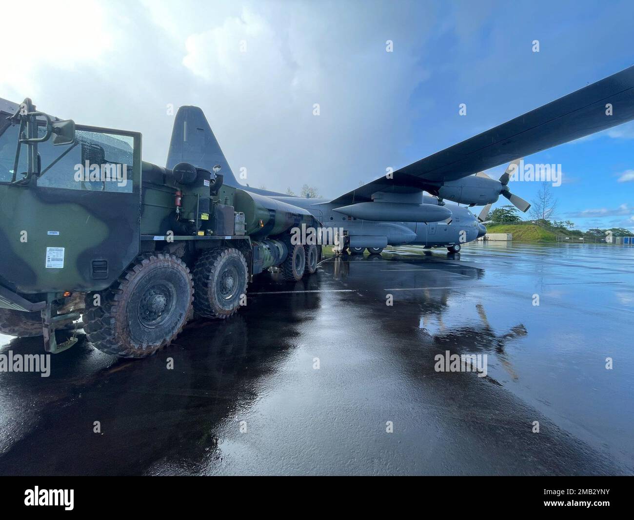 Fuelers from Charlie Battery, 1-1 ADA BN refuel a C-130 aircraft at ...