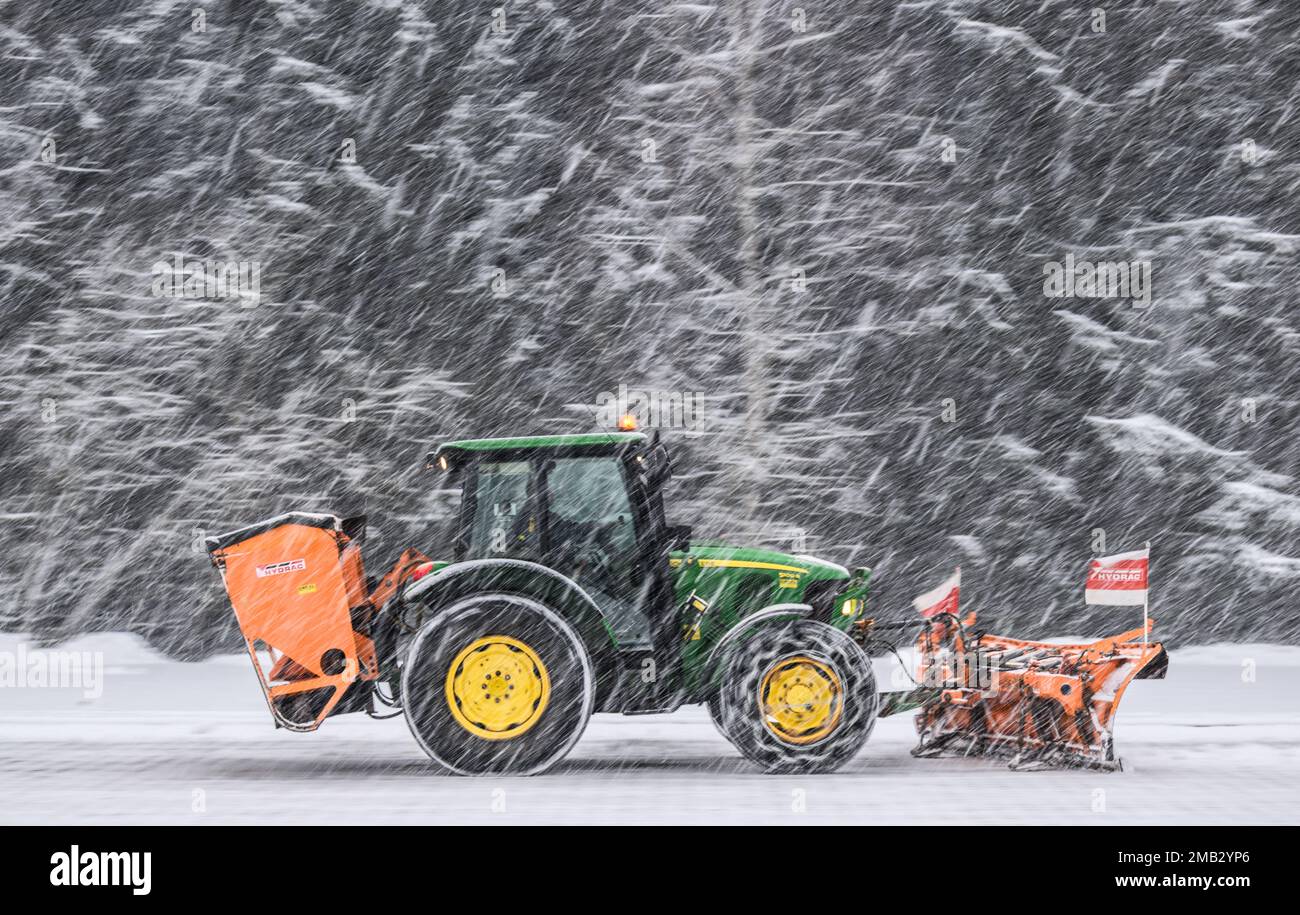 Altenberg, Germany. 20th Jan, 2023. A tractor with a snow plow pushes ...