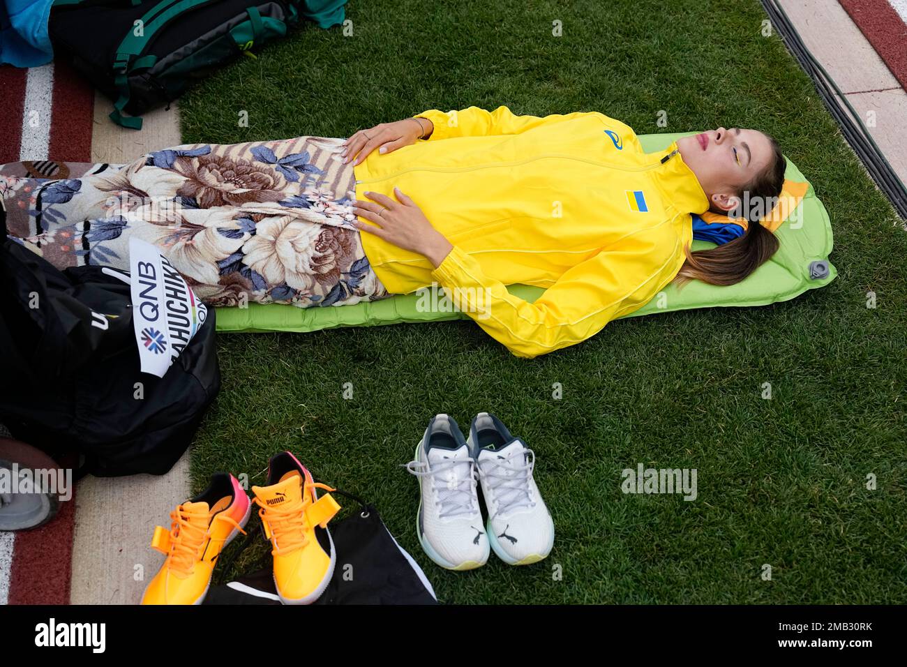 Yaroslava Mahuchikh, of Ukraine, lies on the field at the World ...
