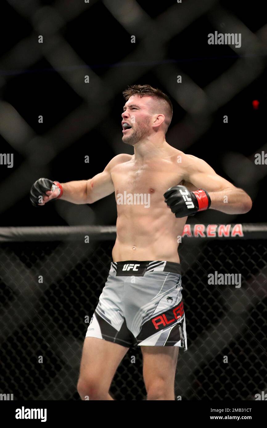 Bill Algeo celebrates a win against Hebert Burns during their mixed ...