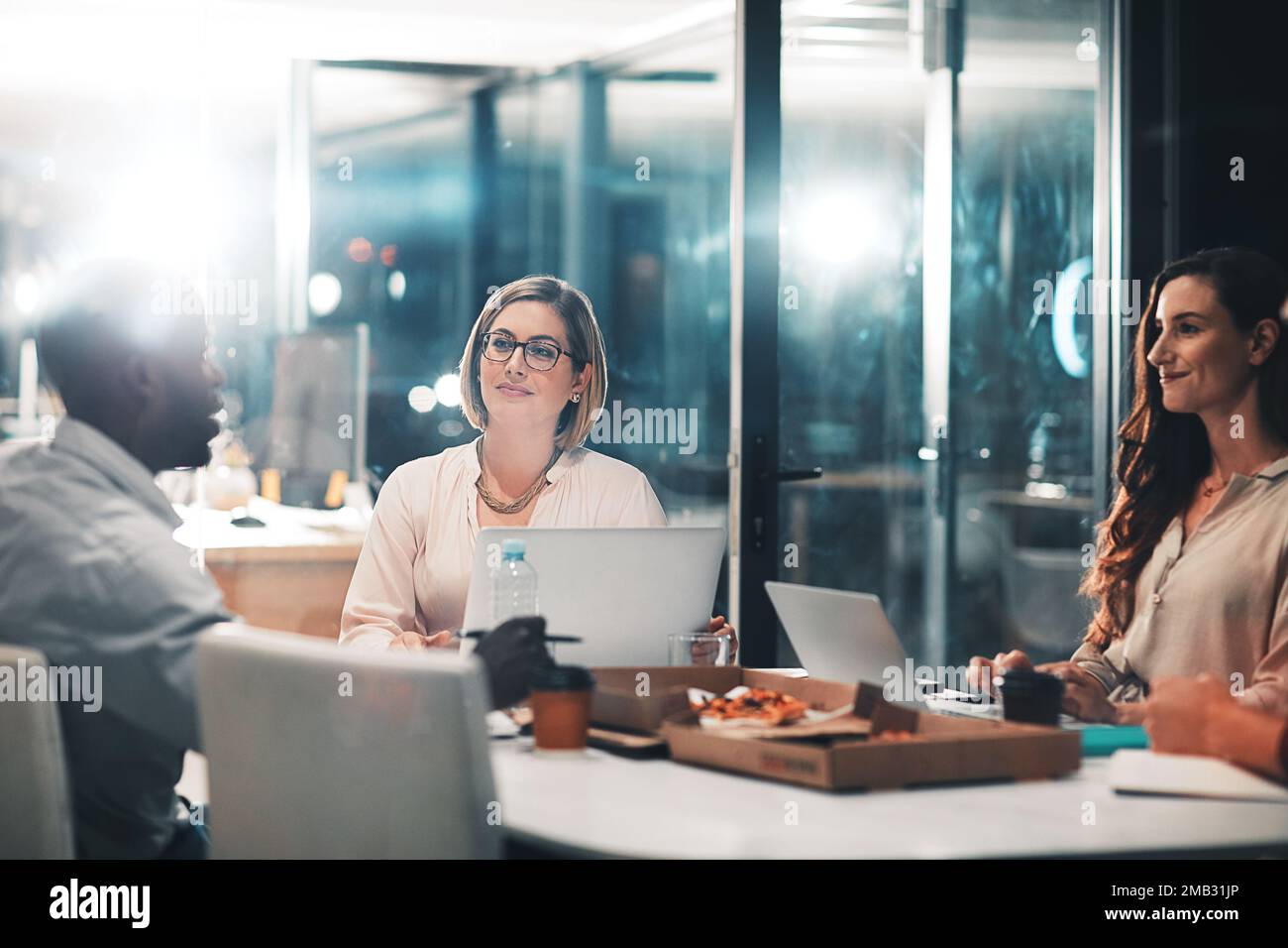 Meeting, late night and marketing team workshop with ideas, laptop and ...