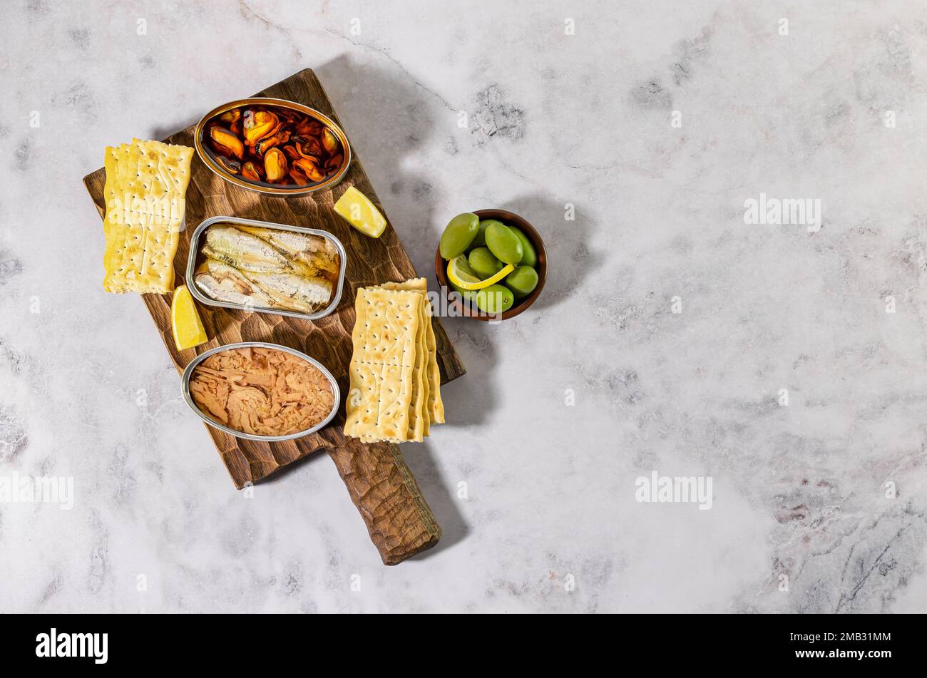 Tinned fish board Stock Photo - Alamy