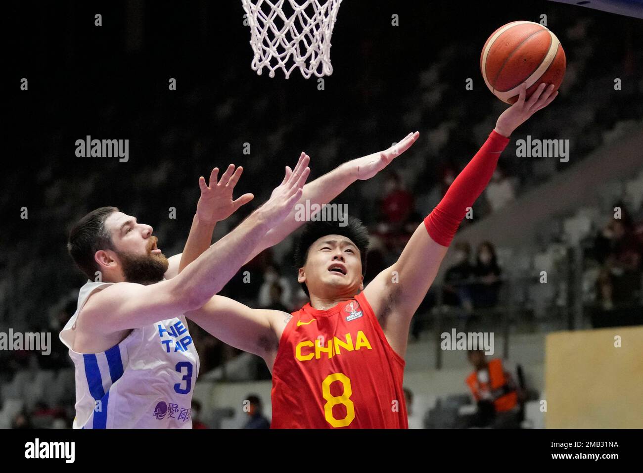 Taiwan's William Artino, left, blocks a shot from China's Zhao Rui ...