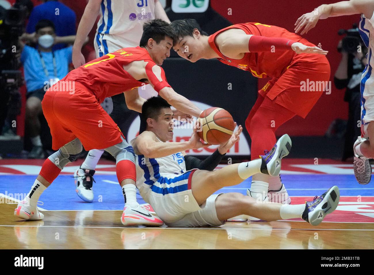 Taiwan's Chen Ying Chun, bottom, battles for the ball against China's ...
