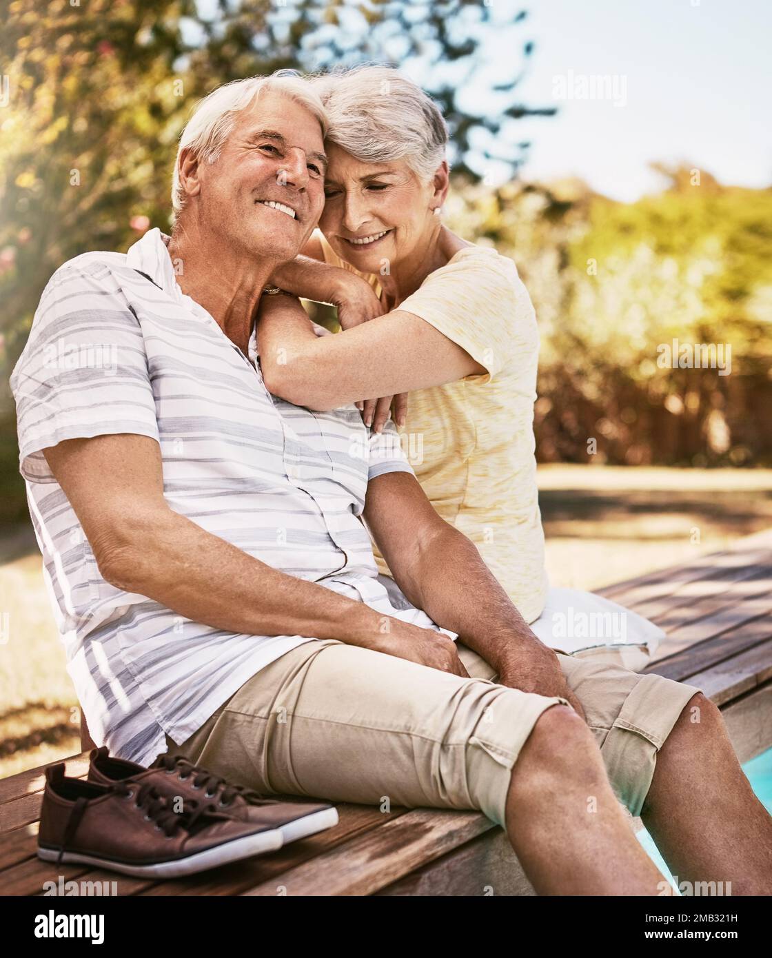 Senior couple, relax and smile by pool in love and summer vacation ...