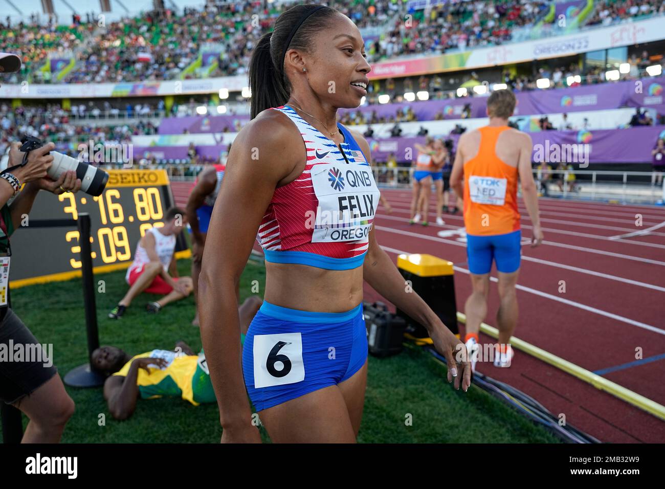 Allyson Felix, of the United States, stands off the the track after ...