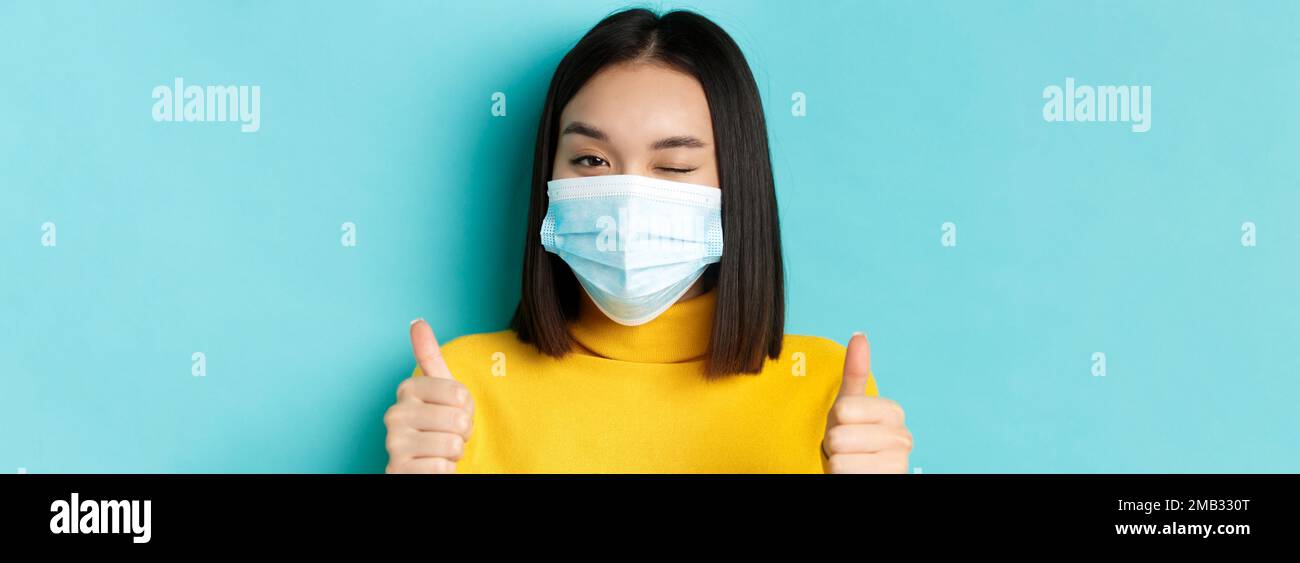 Covid-19, social distancing and pandemic concept. Cute asian girl in ...