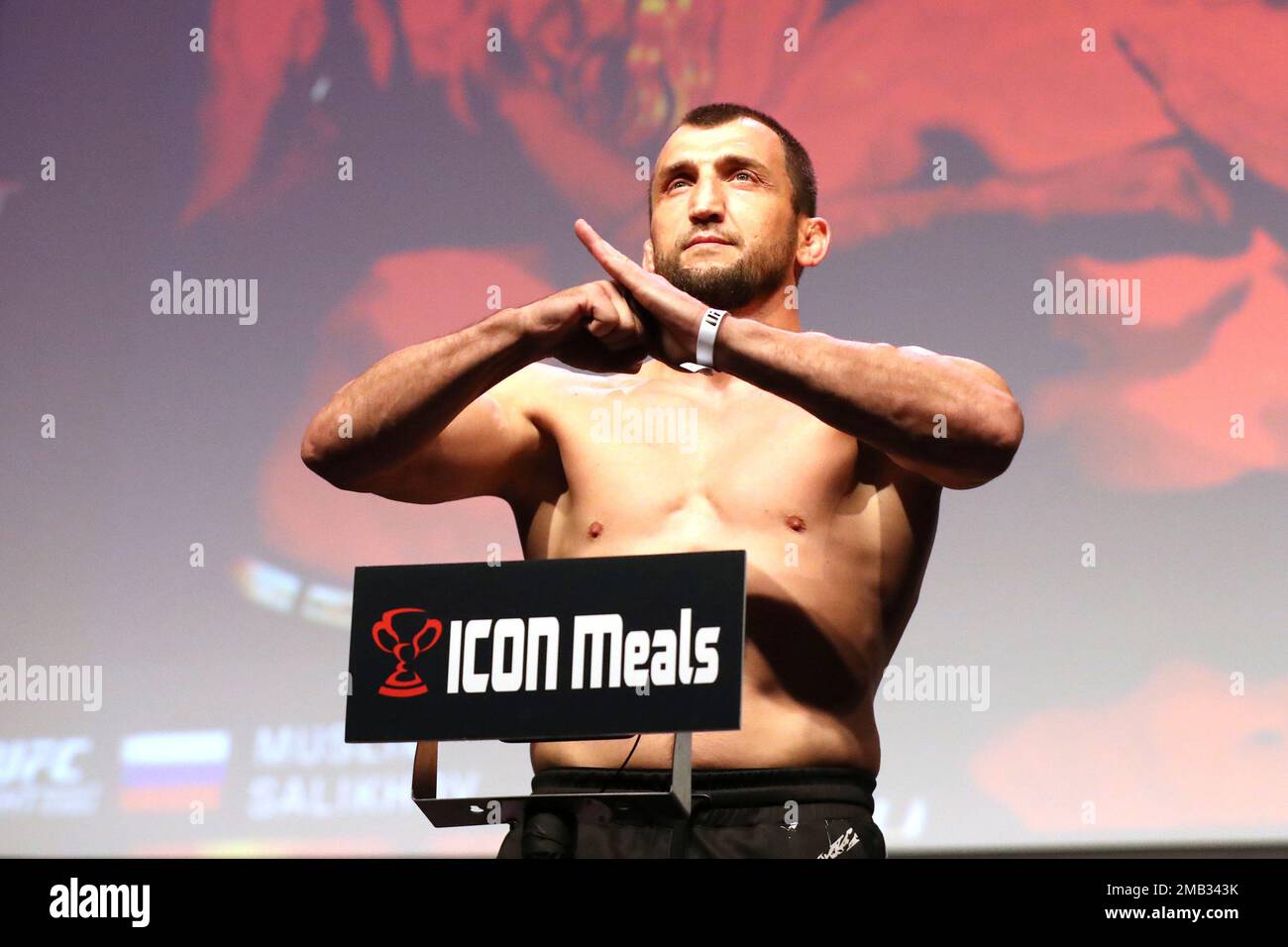 Muslim Salikhov poses on the scale at the ceremonial weigh-in for the ...
