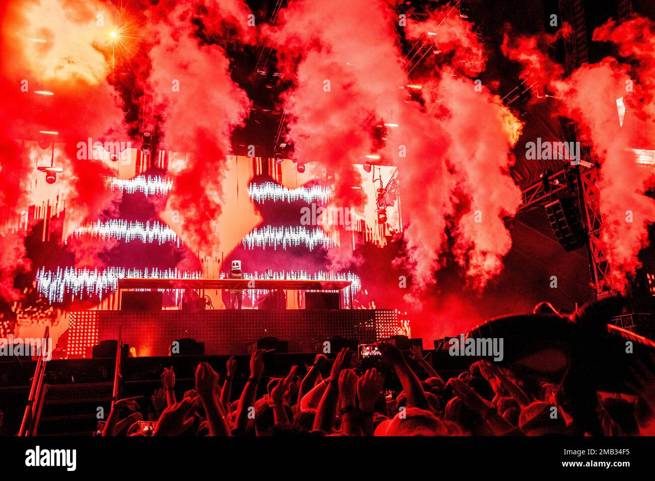 Music fans cheer for American electronic music producer and deejay ...