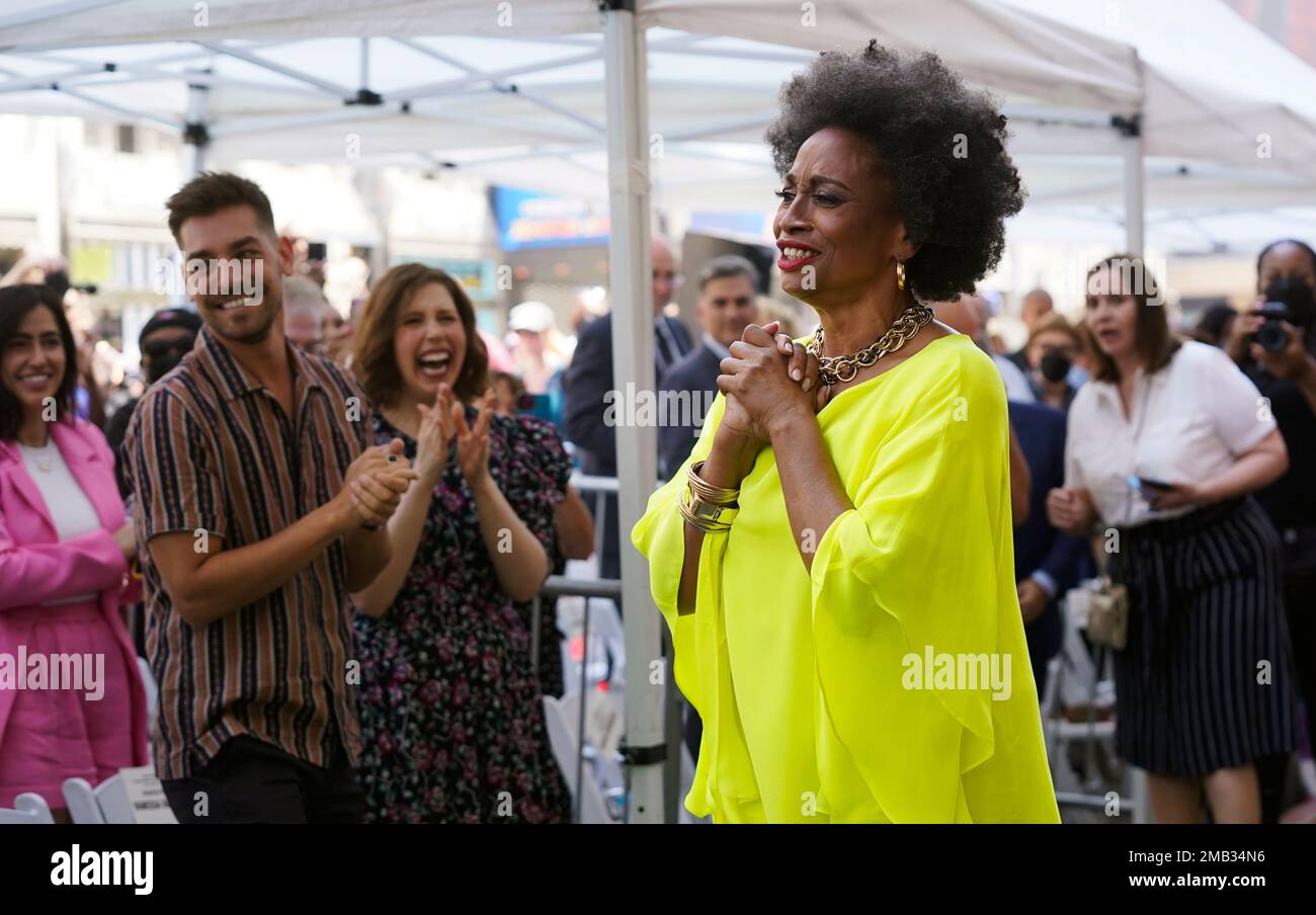 Actor Jenifer Lewis, right, is greeted by the crowd as she arrives for ...