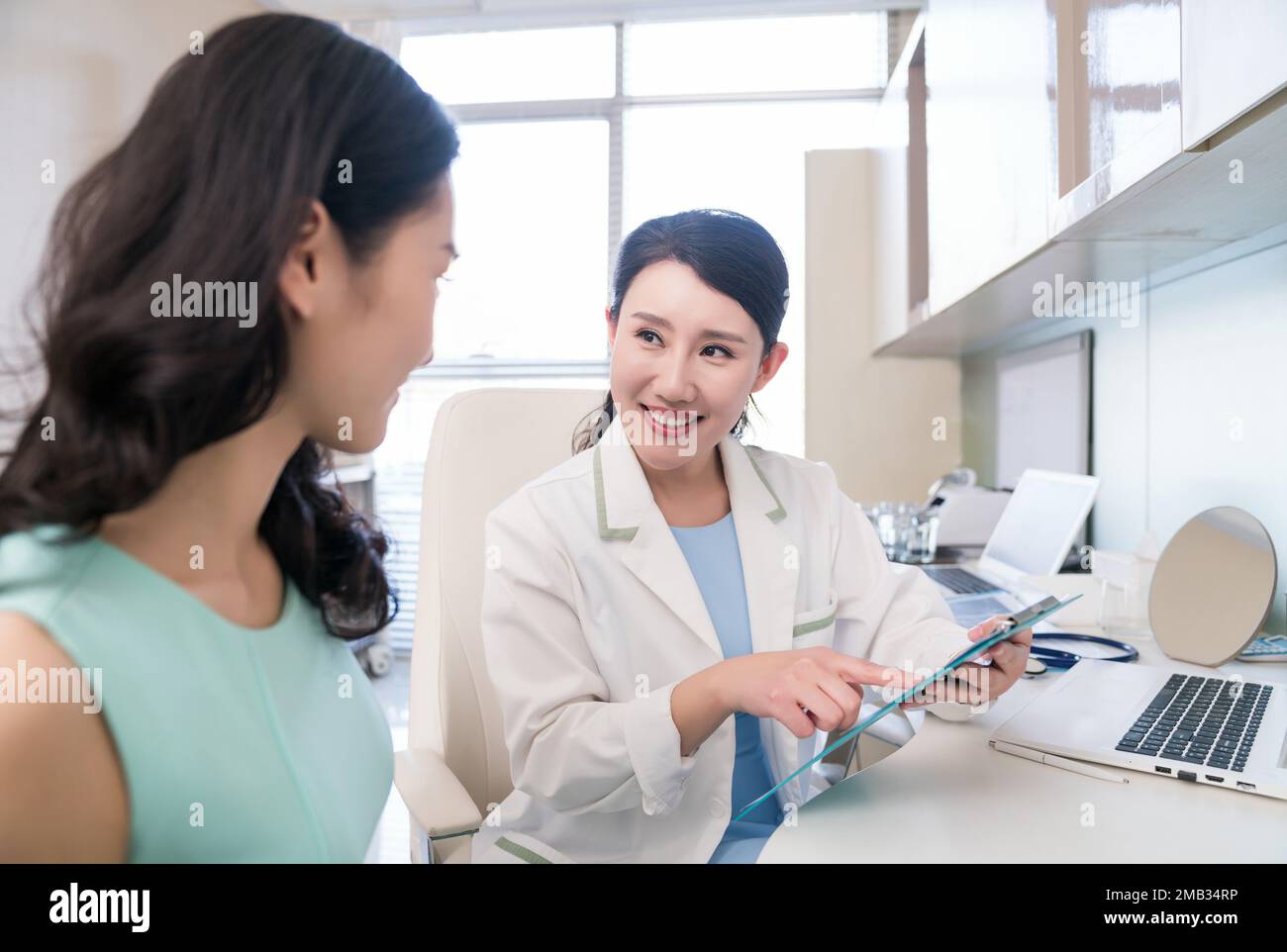 Professional reception young woman Stock Photo - Alamy