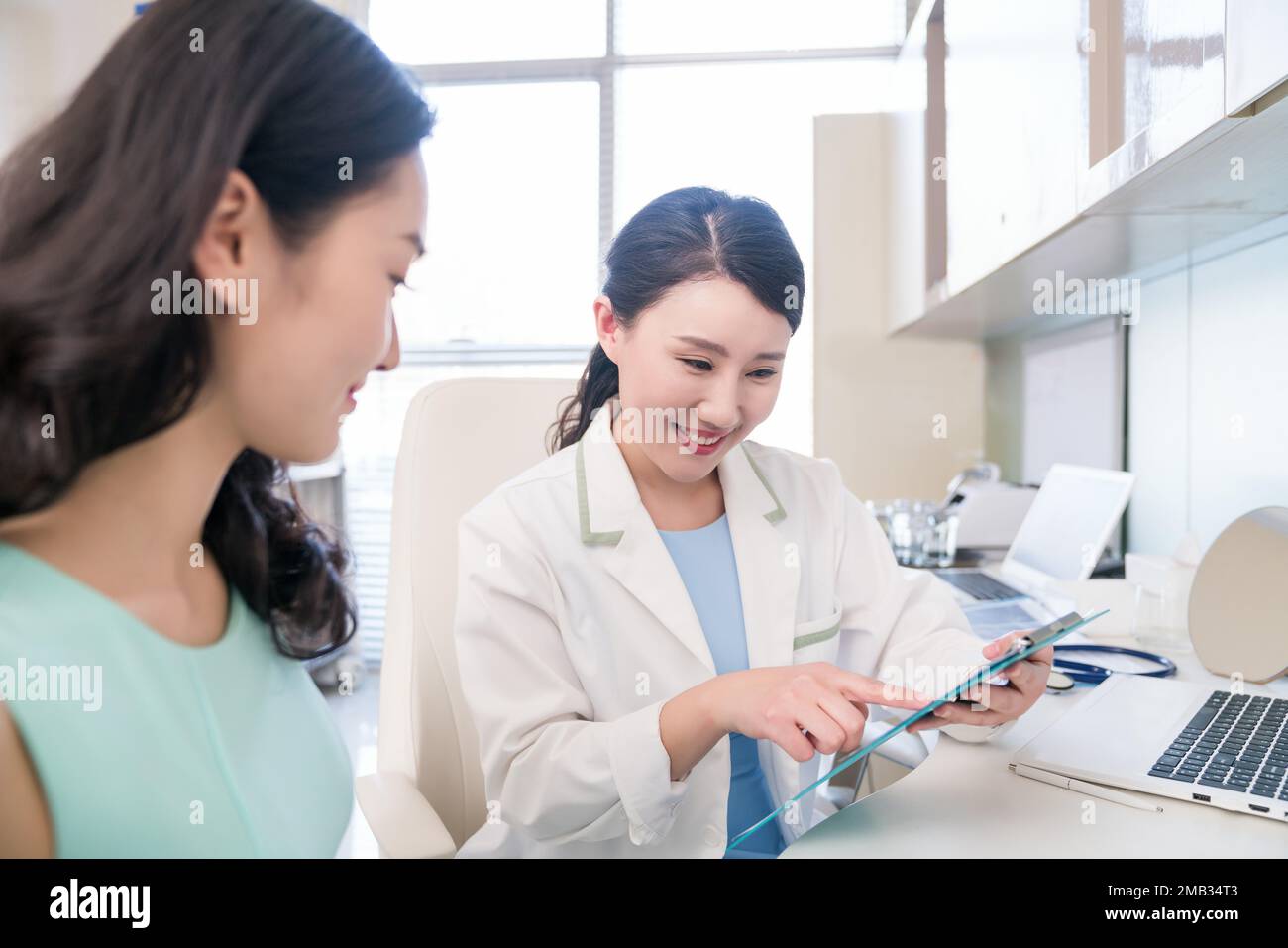Professional reception young woman Stock Photo - Alamy