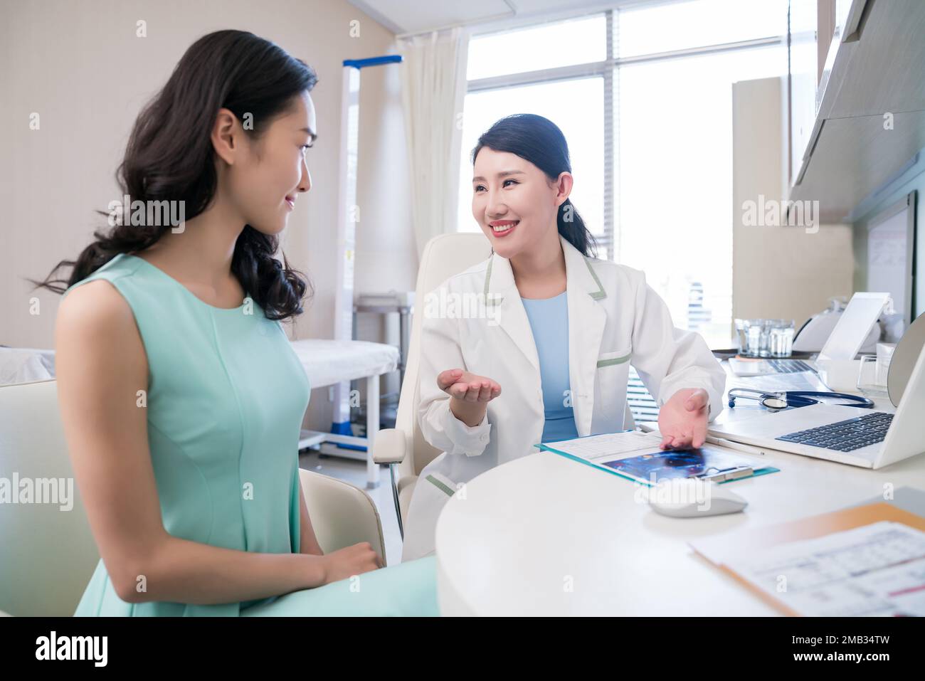 Professional reception young woman Stock Photo - Alamy