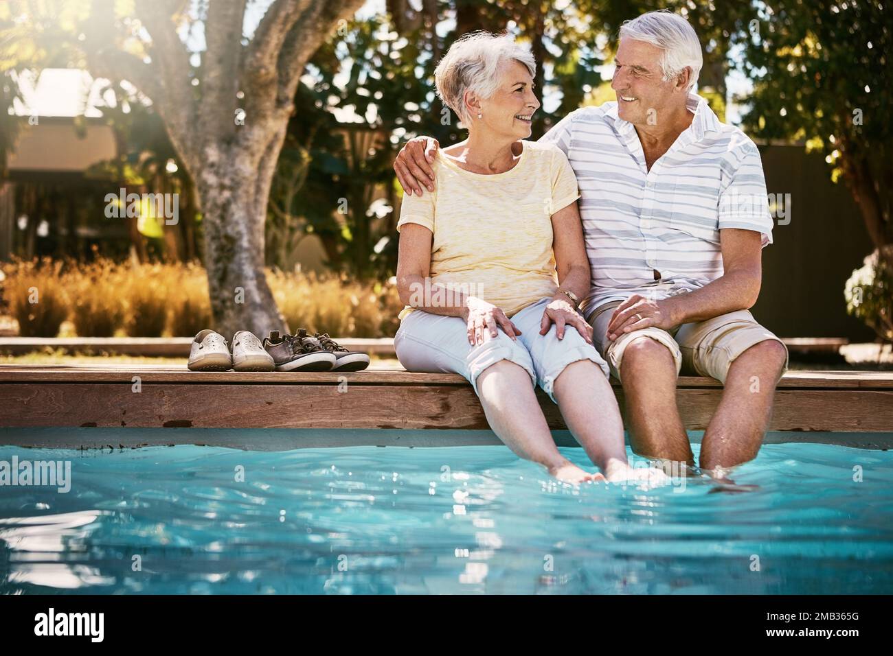 Senior Couple Hug And Swimming Pool For Holiday In Relax For Love Or