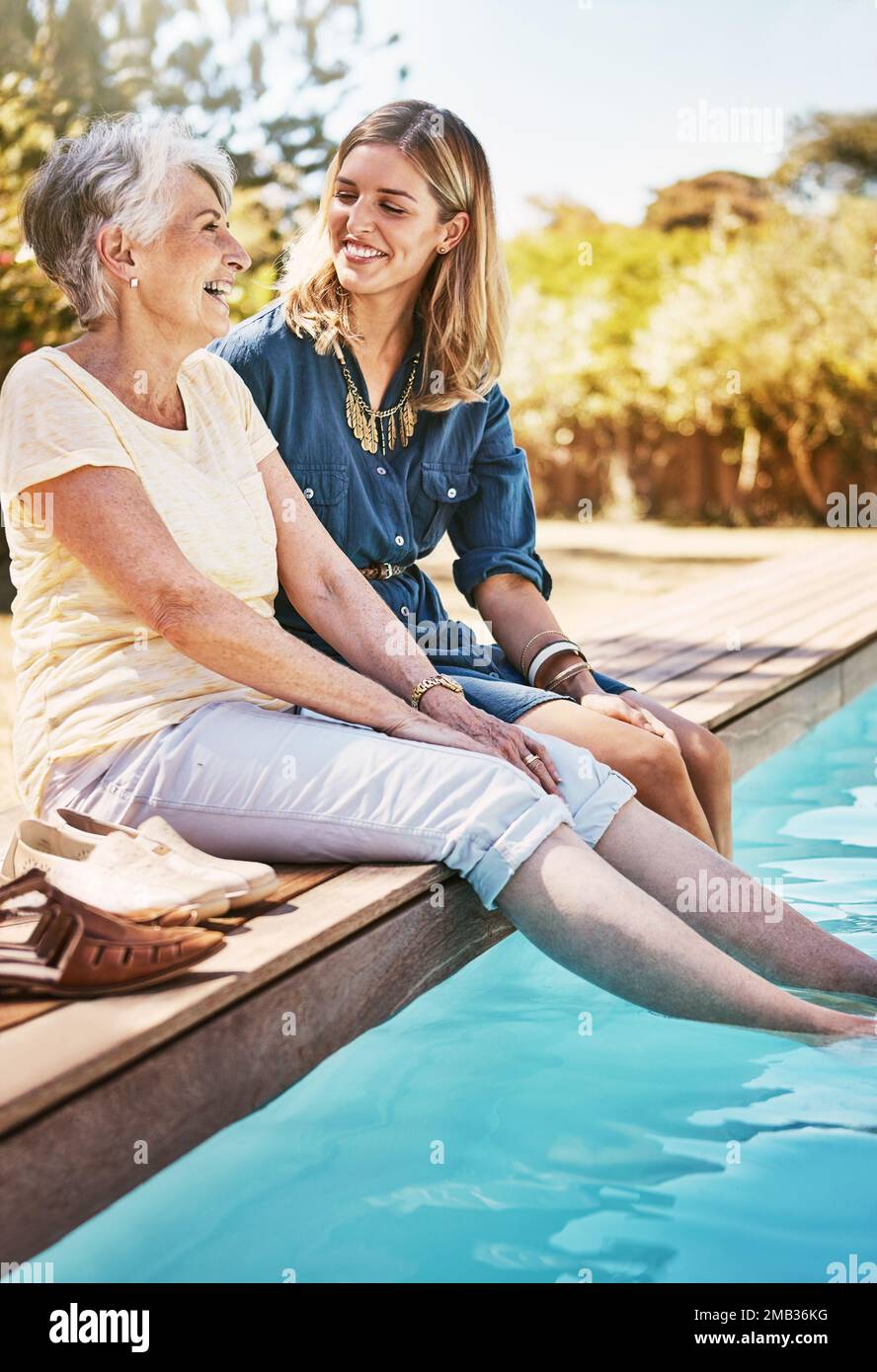 Women relax together, happy and swimming pool, love with care and ...