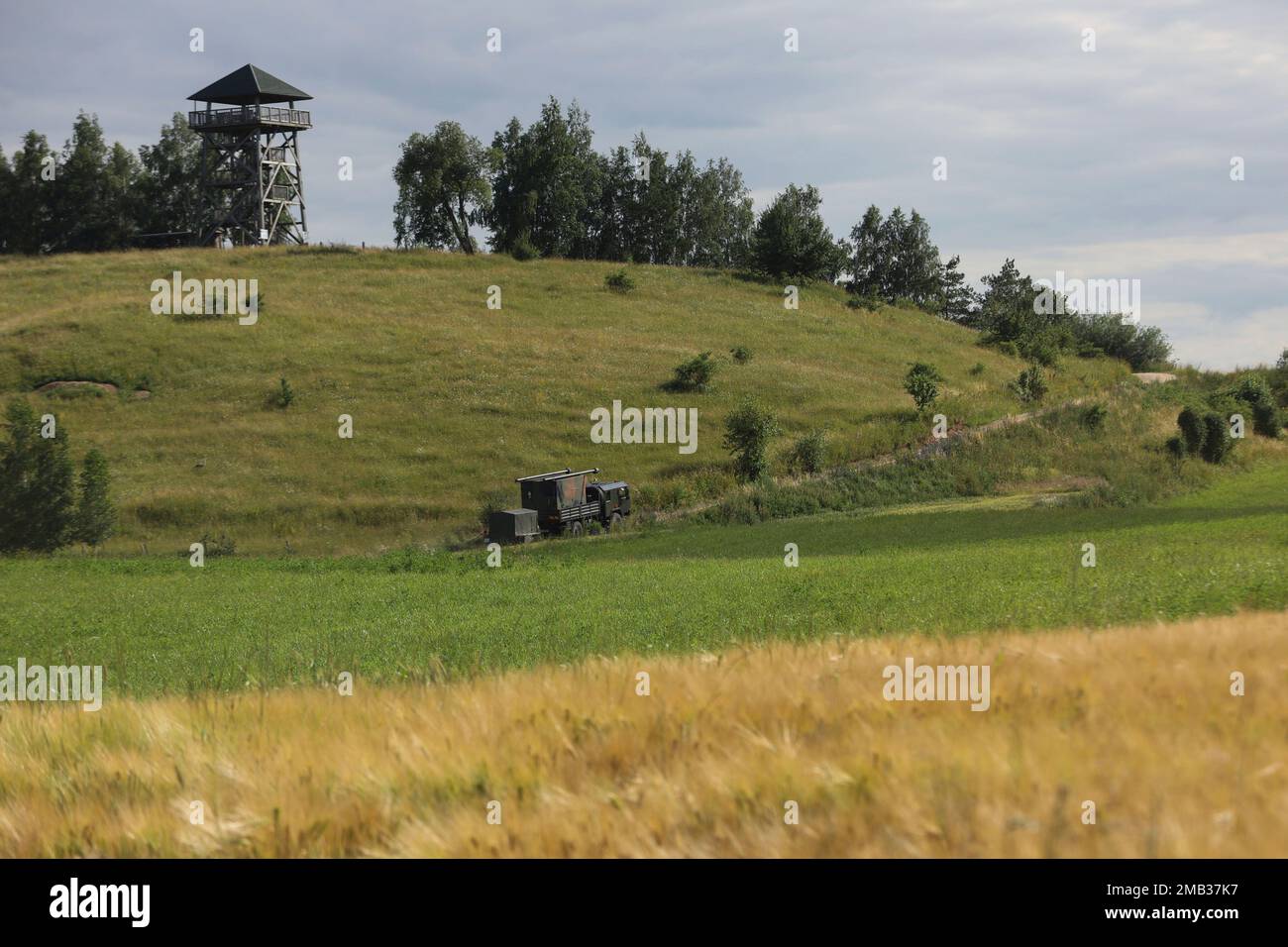 A military truck drives up the hill in Baranowo, Poland, Thursday, July ...
