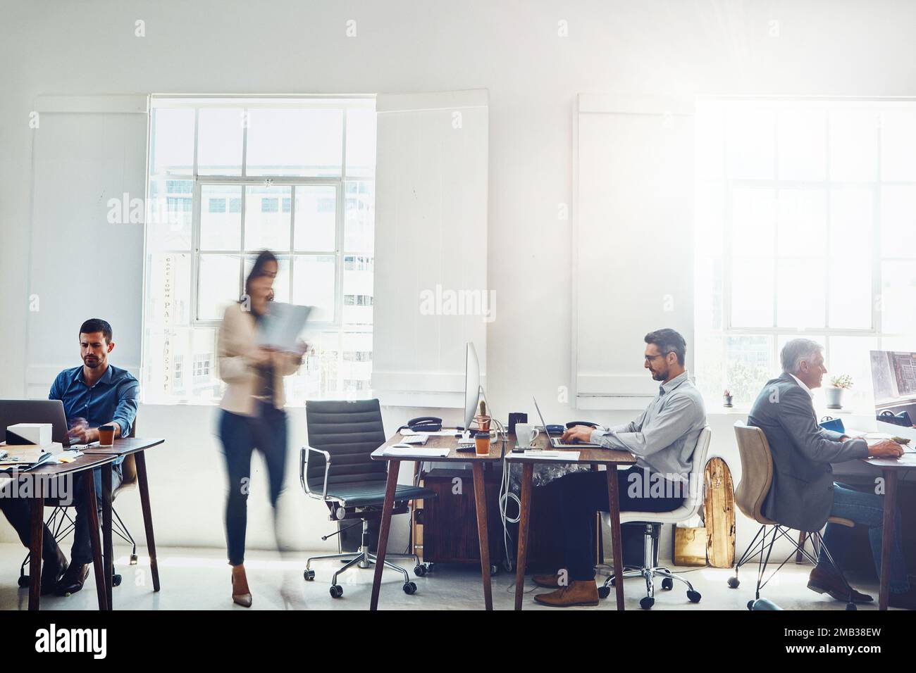 Teamwork, collaboration and business people coworking in busy office ...