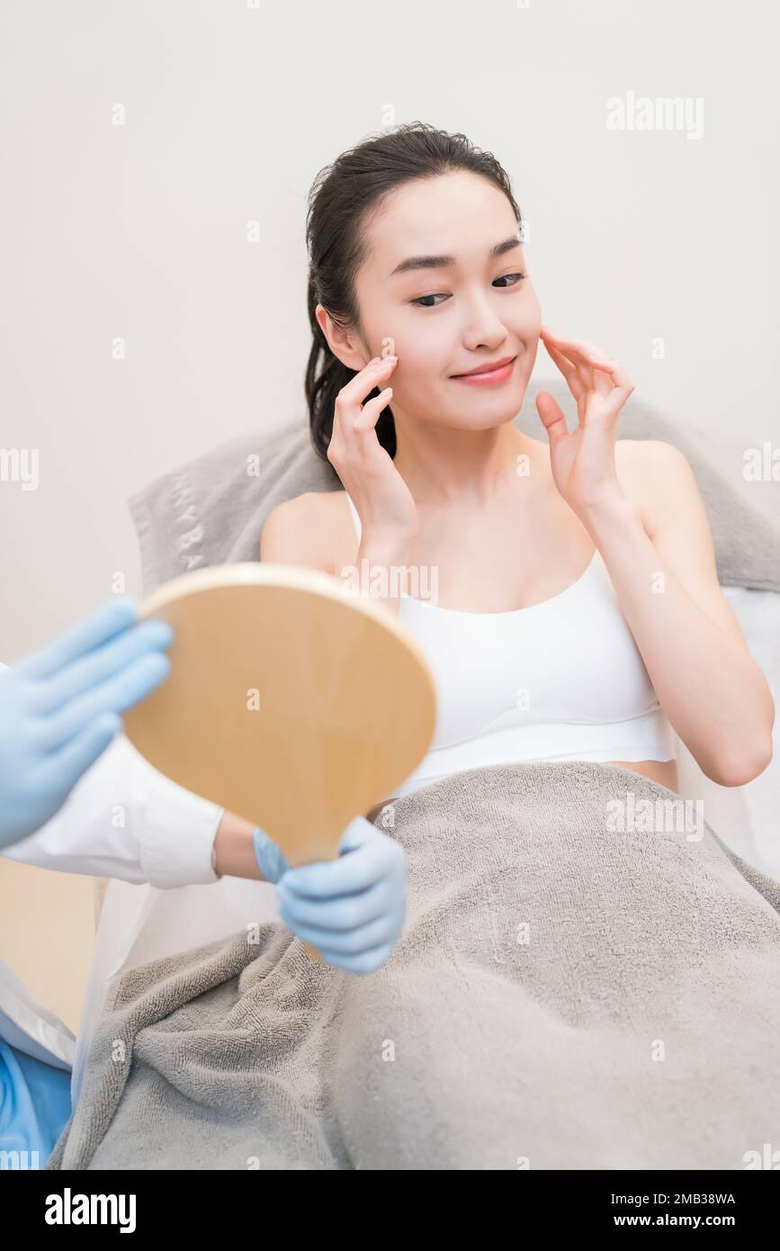 Professional reception young woman Stock Photo - Alamy