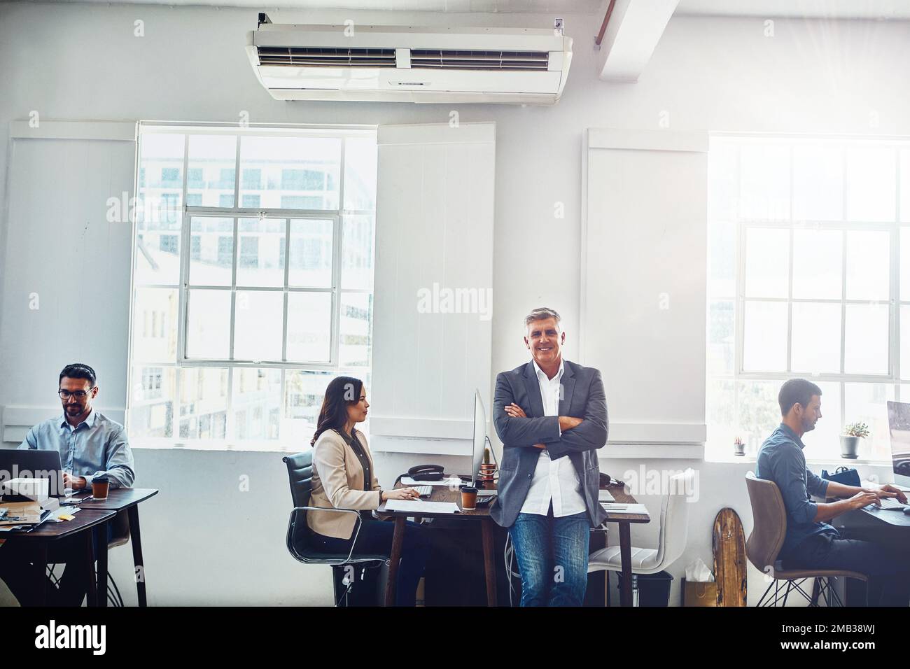 Man, leader and office portrait with staff, happy and confident smile with arms crossed for ...