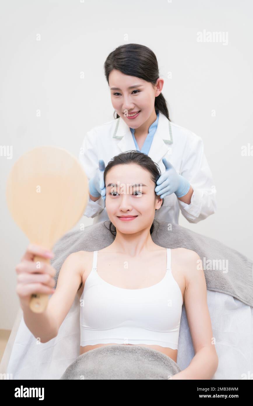 Professional reception young woman Stock Photo - Alamy