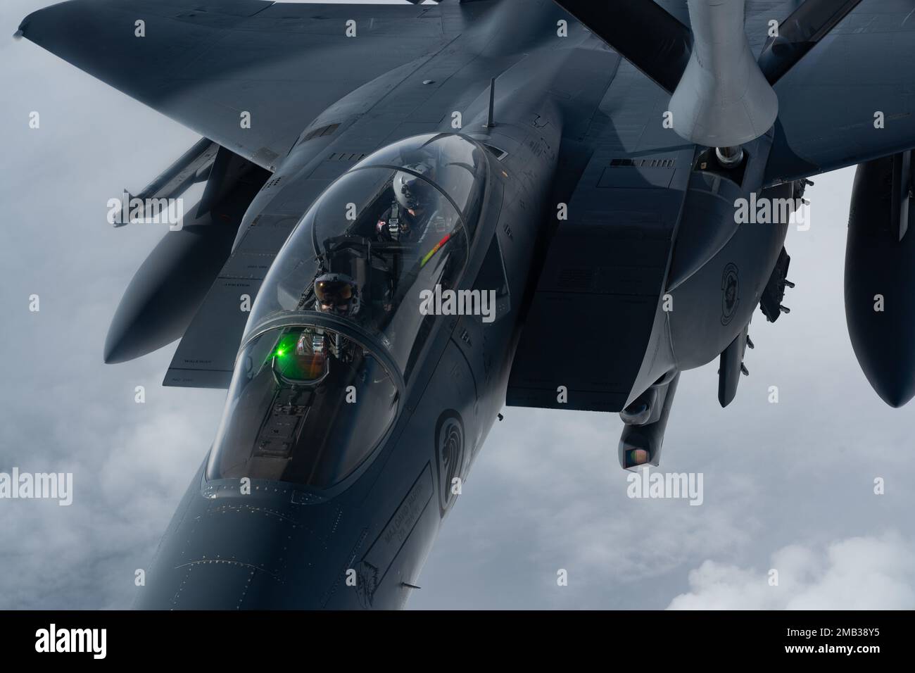 A F-15SG Strike Eagle receives fuel from a KC-135 Stratotanker over the ...